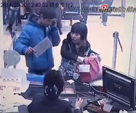 Chinese bank teller becomes internet sensation for belly laughing at ...