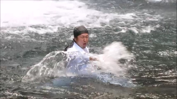 Karate dojo students practice under freezing waterfall… in the middle ...