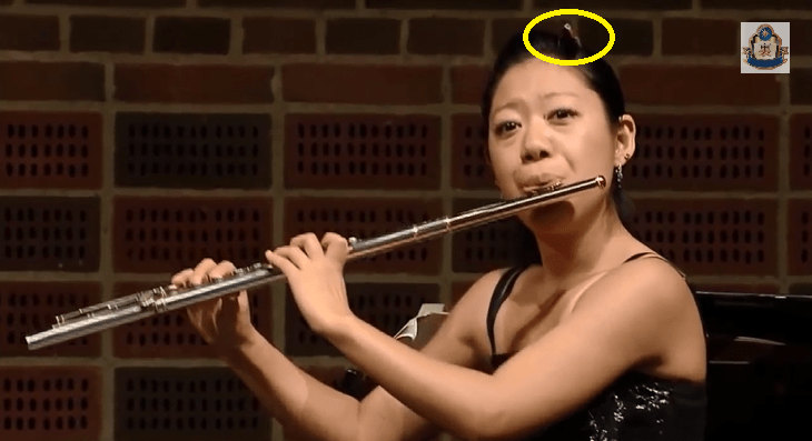 Japanese flutist keeps her cool, plays beautifully even with a ...
