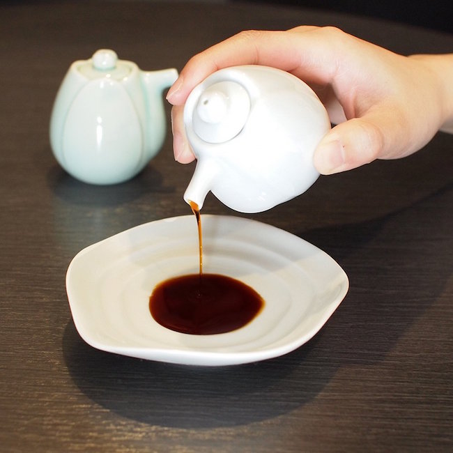 Unique soy sauce cruet saucer creates beautiful liquid art right on ...