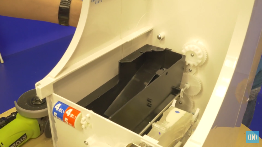 Father and son dissect a gachapon capsule toy machine to show us its ...