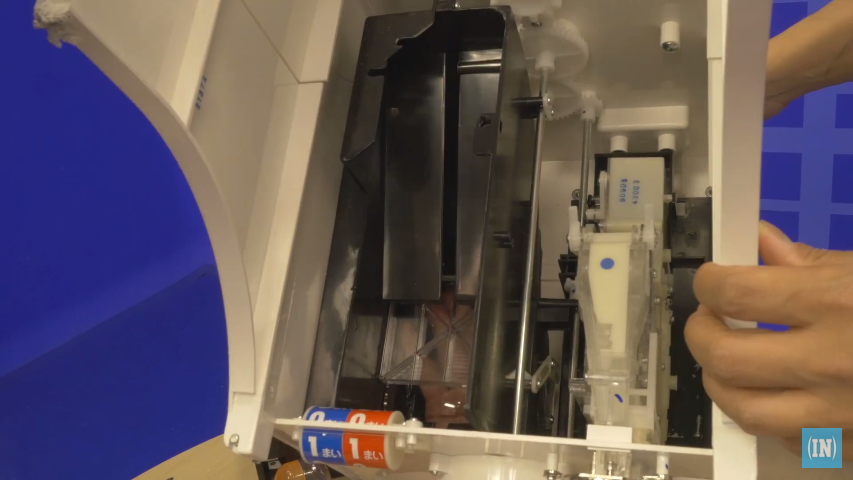 Father and son dissect a gachapon capsule toy machine to show us its ...