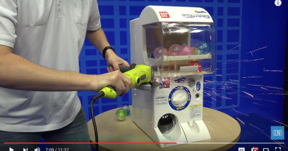 Father and son dissect a gachapon capsule toy machine to show us its ...