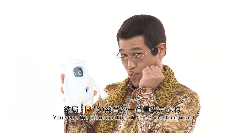 Pikotaro gets English pronunciation training for PPAP from AI robot ...