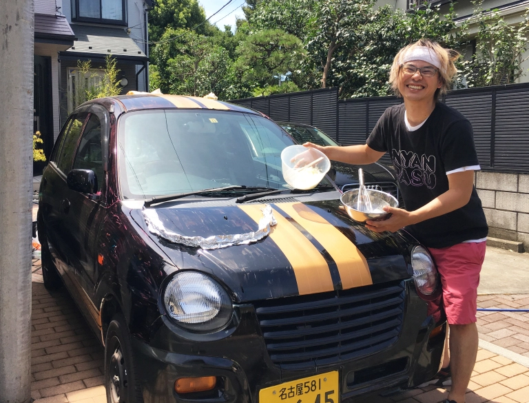 We cook a monjayaki Japanese pancake on the hood of a car during Japan ...