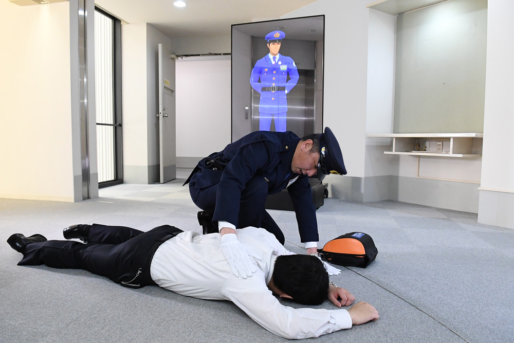 This handsome anime-style security guard will be protecting actual ...