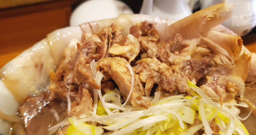 Mighty, meaty Tokyo ramen joint flips script by overflowing the bowl ...