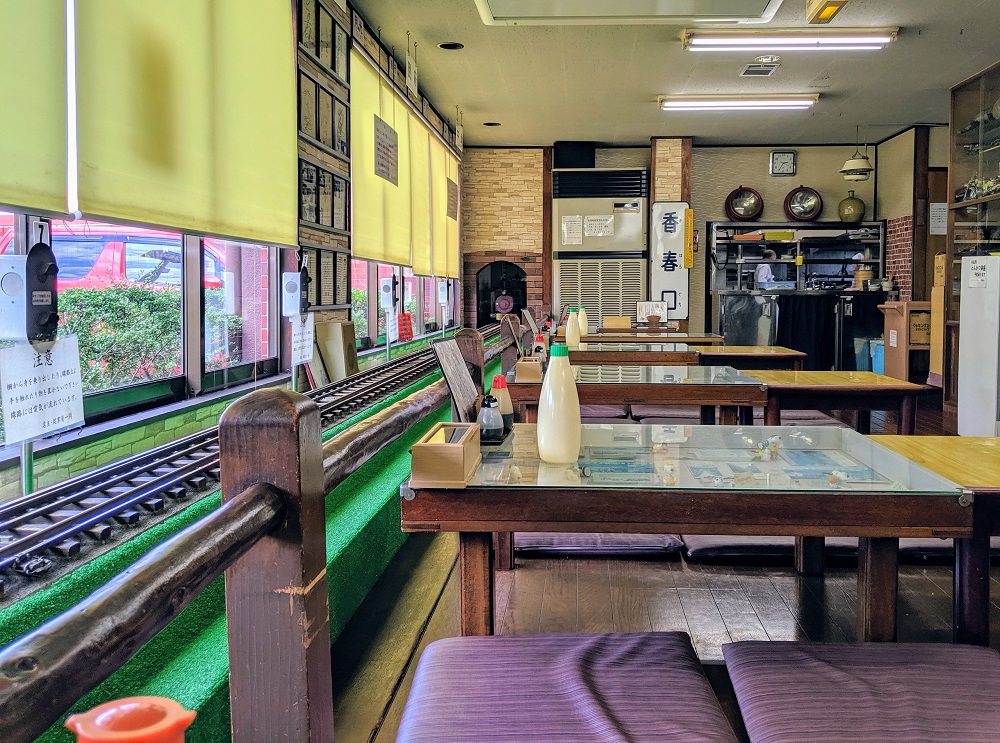 Japanese restaurant serves meals to diners via a moving steam ...