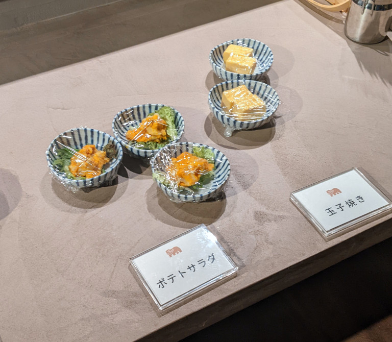 We eat a luxurious Japanese-style buffet breakfast in a restaurant full ...