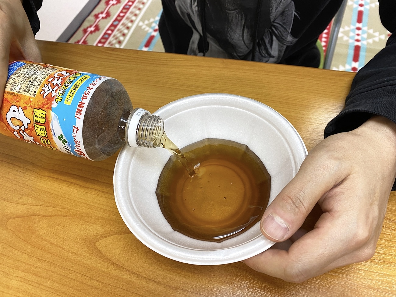 We try a half-drunk bottle of tea that’s been sitting on the balcony ...