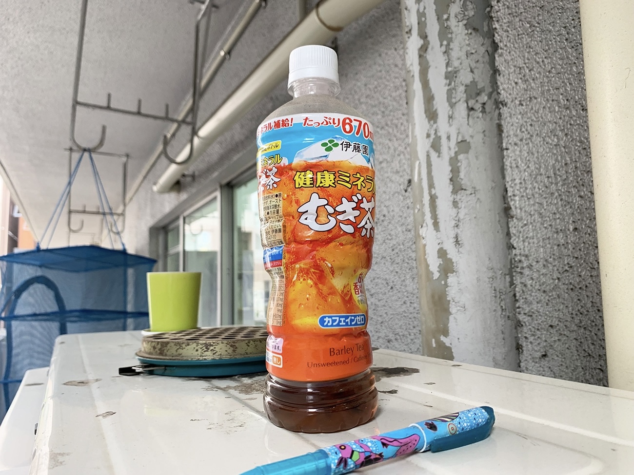 We try a half-drunk bottle of tea that’s been sitting on the balcony ...