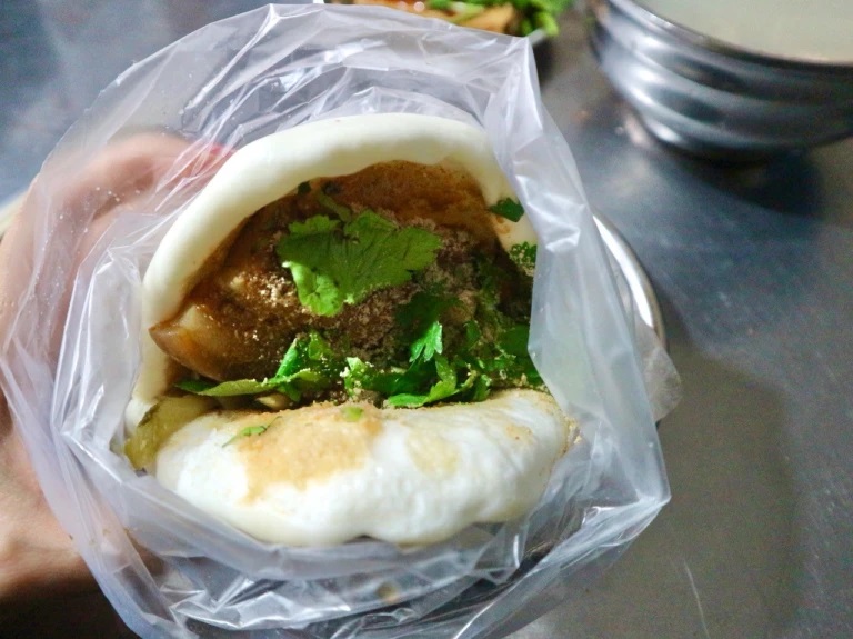 We tried gua bao pork belly buns in a local Taipei night market that’s ...