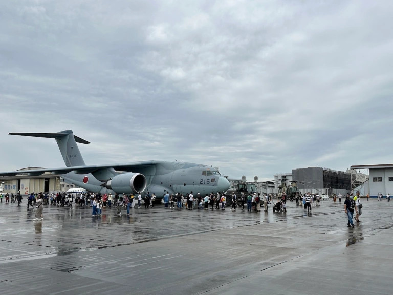 We go to a festival on a Japanese Air Self-Defense Force base, walk on ...
