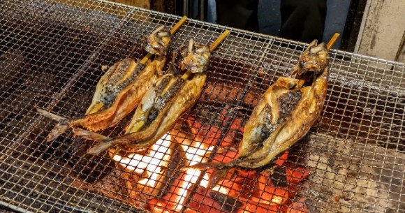 Mr. Sato is in fish heaven after tasting the freshly grilled mackerel ...