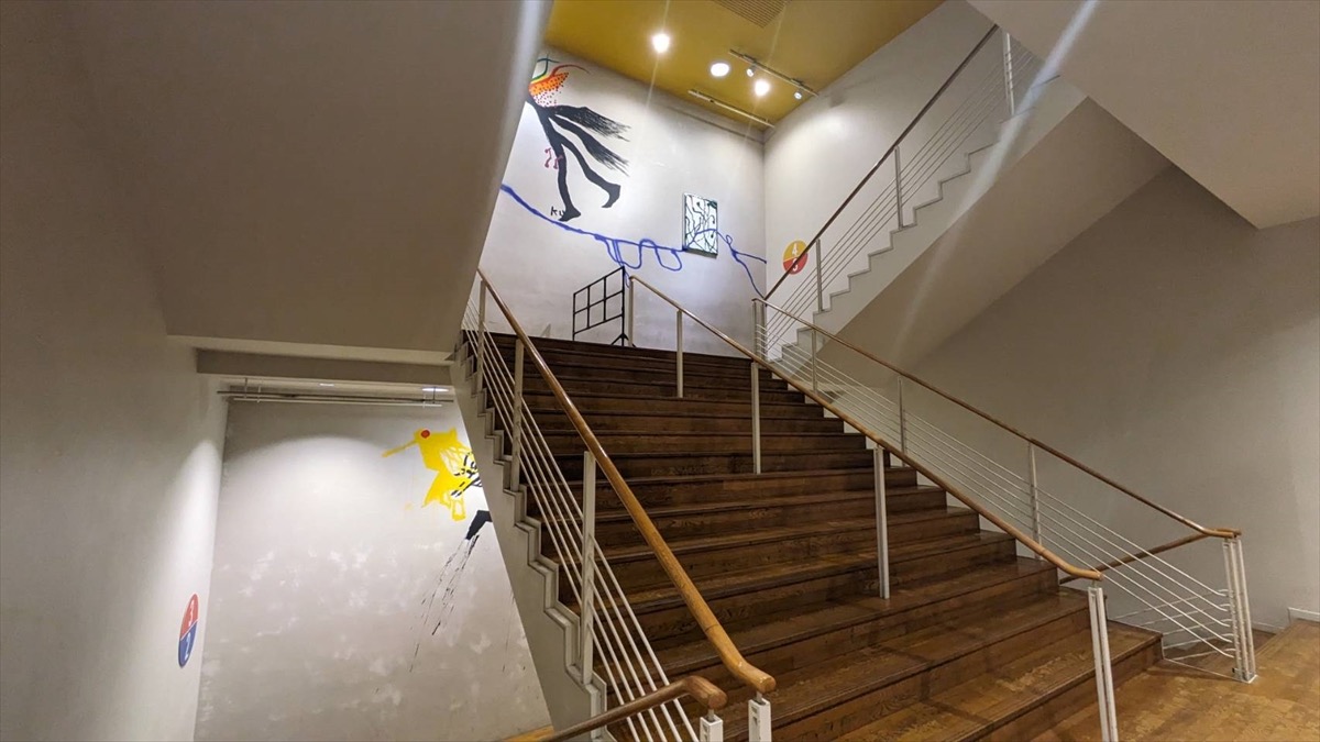 Unusual curved escalators are the crowning jewel of this shopping mall ...