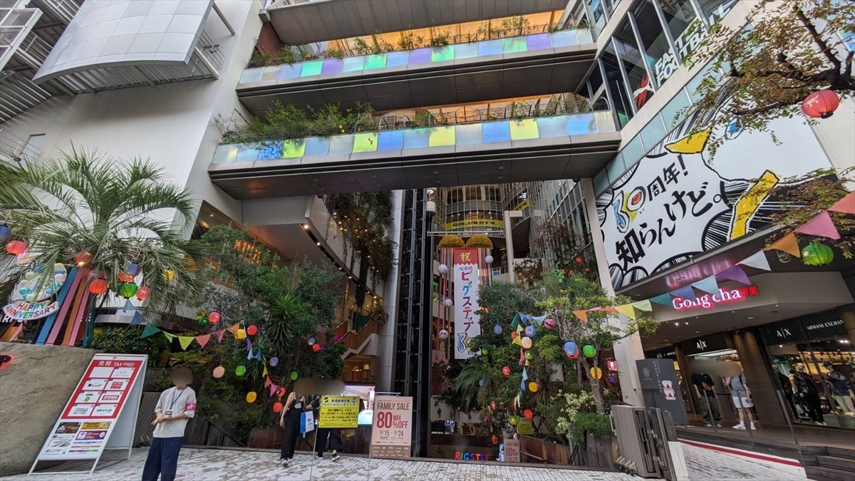 Unusual curved escalators are the crowning jewel of this shopping mall ...