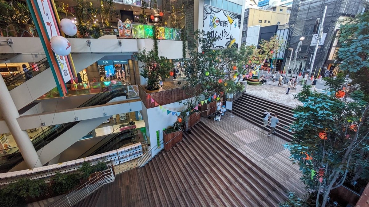 Unusual curved escalators are the crowning jewel of this shopping mall ...