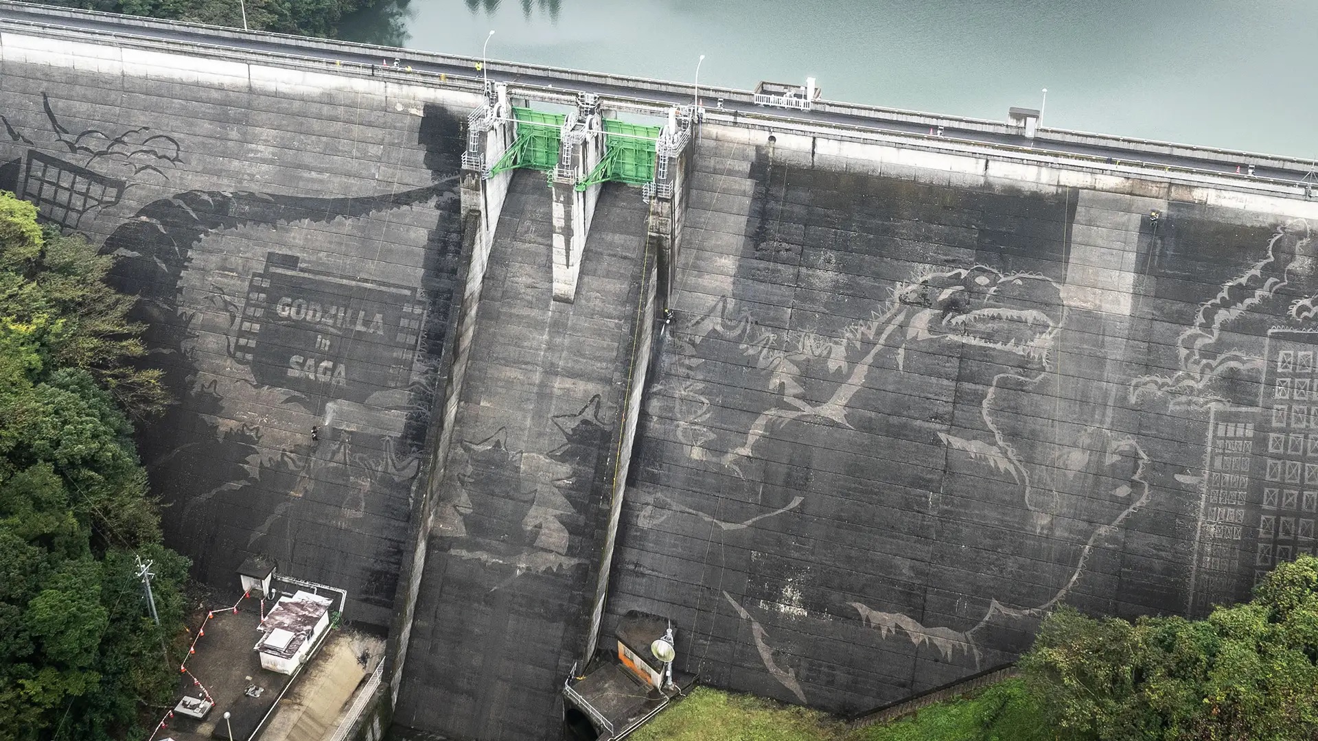 Big dam Godzilla appears in Japan as power-washer art on side of 195 ...